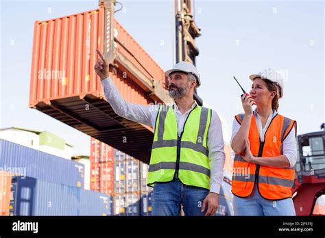 Male And Female Manager Discuss And Checking About Their Job For Shipment To Customer
