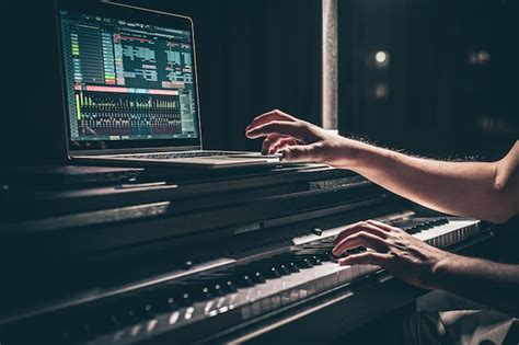Premium Photo A Man Composer Producer Arranger Songwriter Musician Hands Arranging Music
