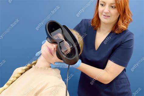 Neurologist Performing Positional Testing Of Patient Using Videonystagmography Vng Testing Uses