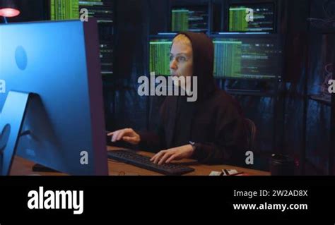 Smiled Woman In Hood Hacking Programs Online And Success Stealing Data From Internet Female