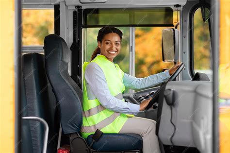 Premium Photo Happy Black Female Driver Sitting In Bus And Looking At