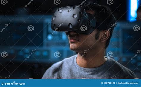 Software Delevoper Wearing Virtual Reality Headset On His Head Developing And Programming Vr