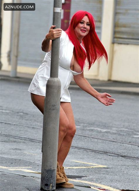Lisa Appleton Sexy In A Red Wig For Local Sex Shop Saint And Sinners Photo Shoot In Blackpool