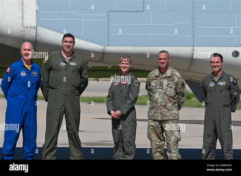 Service Members Stand Next To An Ec 37b Compass Call After Its Arrival