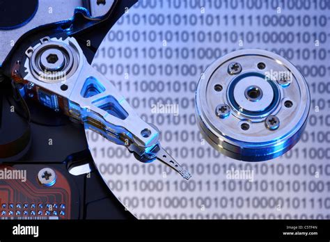 computer hard drive opened writing reading head and hard disk stock