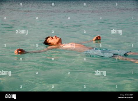 Man Floating In Tropical Water Stock Photo Alamy