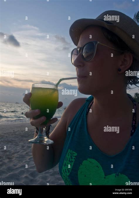 Tourist Drinking A Cocktail On The Beach In Boracay Philippines Stock