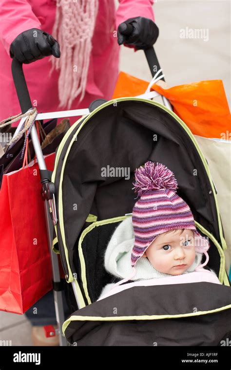 Mother Walking With Baby In Stroller Close Up On Baby Stock Photo Alamy