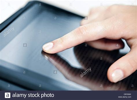 Female Hand Touching Tablet Computer Screen With Finger Stock Photo Alamy