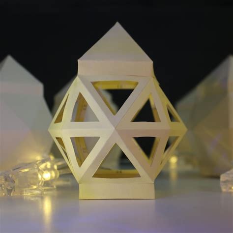 Premium Photo A White Cube With A Triangle Shaped Design On It
