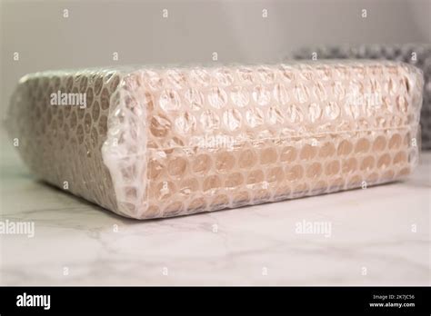 Bubbles Covering The Box By Bubble Wrap For Protection Product Cracked Or Insurance During Bubbles Covering The Box By Bubble Wrap For Protection Product Cracked Or Insurance During