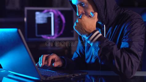 Hacker Typing Program Code While Committing A Cybercrime Hacking A System Firewall In The Dark