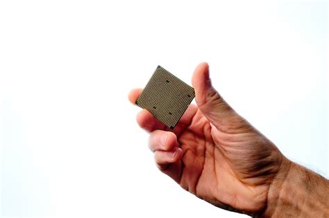 Premium Photo Man S Hand Holding A Microchip