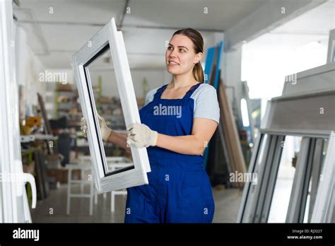 Female Master Is Working With Window Frame In The Window Workshop Stock Photo Alamy
