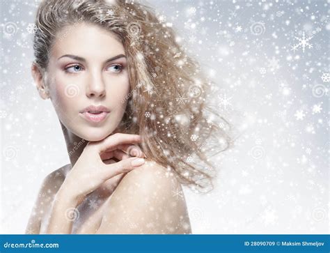 Portrait Of A Young Naked Woman On A Snow Background Royalty Free Stock