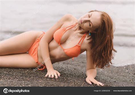 Beautiful Woman Orange Bikini Beach Selective Focus Stock Photo