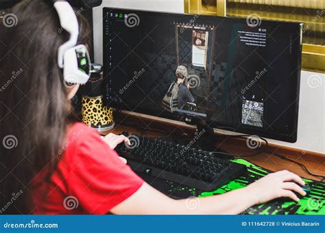 Gamer Girl Seated In Front Of The Computer Playing Pubg Editorial