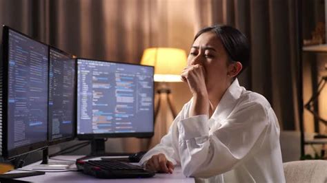 Asian Woman Programmer Yawning While Creating Innovative Software Engineer Developing App
