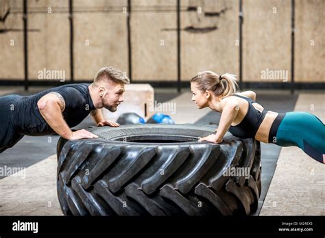 Couple Pushing Ups In The Gym Stock Photo Alamy