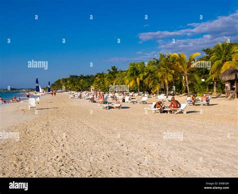 Jamaica Negril View To Sandy Beach With Sunbathing Tourists Stock