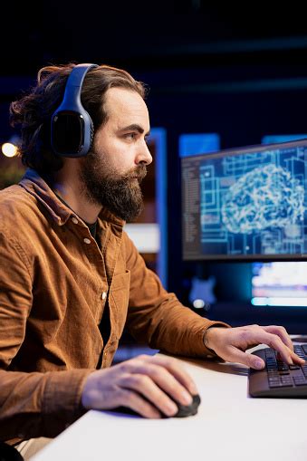 Programmer Listening Music While Doing Maintenance On Artificial