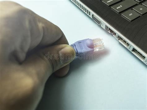 Hand Plugging In The Internet Cable To A Laptop Stock Image Image Of Cable Computer