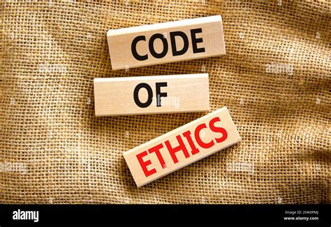 Code Of Ethics Symbol Concept Words Code Of Ethics On Wooden Blocks On A Beautiful Canvas Table
