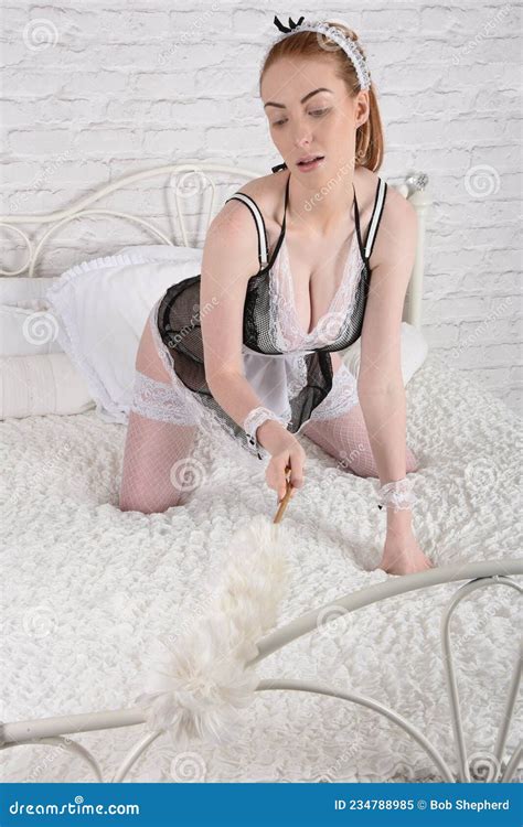Tall Attractive Redhead Model Dressed As A Fantasy Maid In Uniform Stock Image Image Of