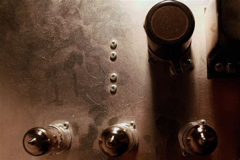 Premium Photo Close Up Of Machine Amplifier Knobs