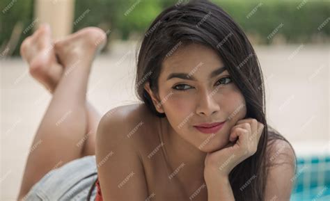 Premium Photo Close Up Of Beautiful Woman Lying At Beach