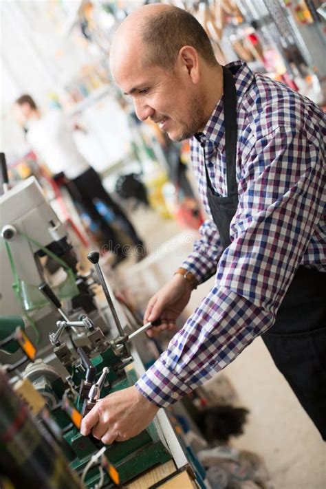 Mature Man Making Duplicates Of Keys Stock Image Image Of Assistance Lifestyle 69385203