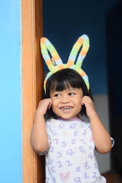 Premium Photo Portrait Of Cute Girl With Bunny Ear Making Funny Face