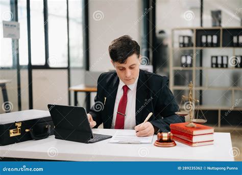 Justice And Law Concept Mature Male Judge In A Courtroom On Table And Counselor Working In