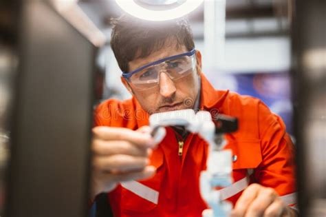 professional technician checking and repairing parts of robotic machine