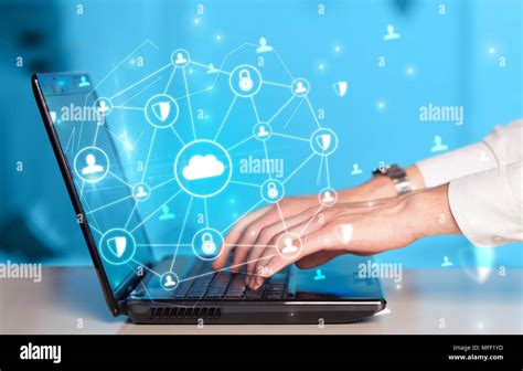 Hand Using Laptop With Centralized Cloud Computing System And Network Security Concept Stock