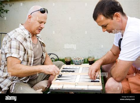 Two Men Playing Backgammon Stock Photo Alamy