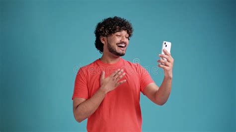 Young Handsome Smiling Indian Man Making Video Call On The Smartphone
