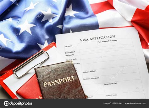 Passports American Flag And Visa Application Form On Table