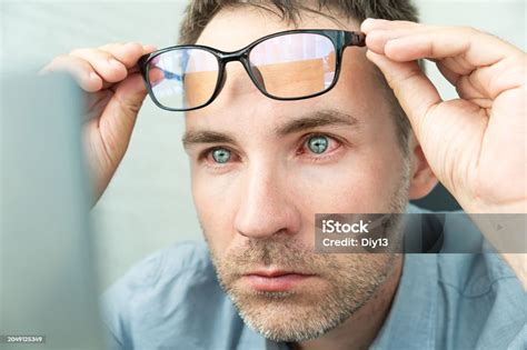 Safety Glasses For Working In Front Of The Monitor Tired Man Take