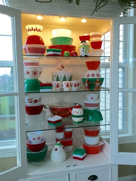 A Display Case Filled With Lots Of Colorful Dishes And Cups On Top Of Glass Shelves
