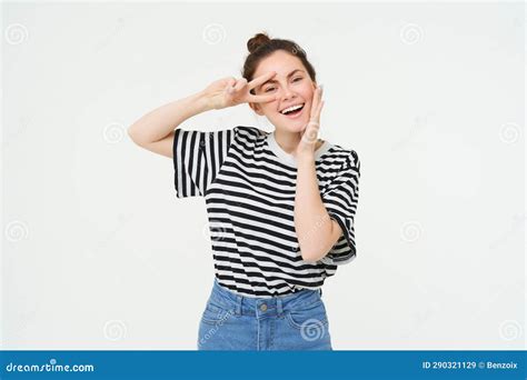 Cute European Woman Posing For Photo Holding Peace Kawaii Hand Gesture Near Face Smiling At
