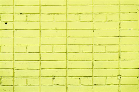 노란 벽돌 벽 텍스처 도시 배경 텍스트에 대 한 공간을 그린 가로 텍스처입니다 초록 빛 배경 패턴 벽지 배너 디자인 텍스트에 대