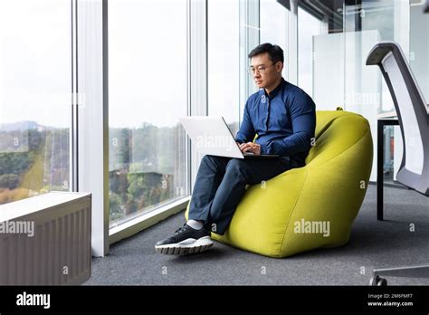 Serious And Focused Engineer Developer Programmer Writing Code Using