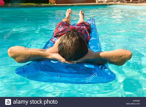 Man Swimming Pool Floating Stock Photos Man Swimming Pool Floating Stock Images Alamy