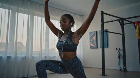 Fitness Model Performing Squat Exercise Highlighting Toned Legs And Core Strength Stock Footage
