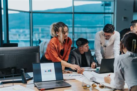 A Multiracial Group Of Business Colleagues Are Brainstorming Ideas And Collaborating On A