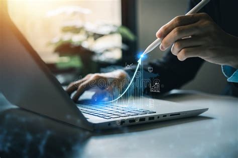 Business Growing Businessman Using Laptop And Smartpen With Virtual Increasing Technical Graph