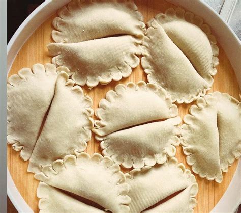 Bengali Bliss Authentic Narikeler Puli Pitha Recipe For Festive Fahima Tasnim
