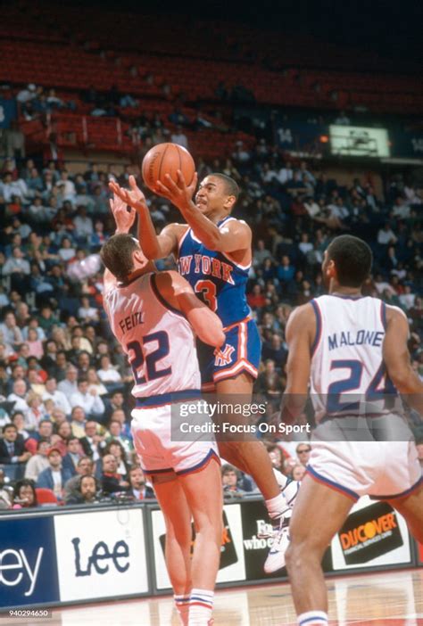 Mark Jackson Of The New York Knicks Shoots Over Dave Feitl Of The News Photo Getty Images