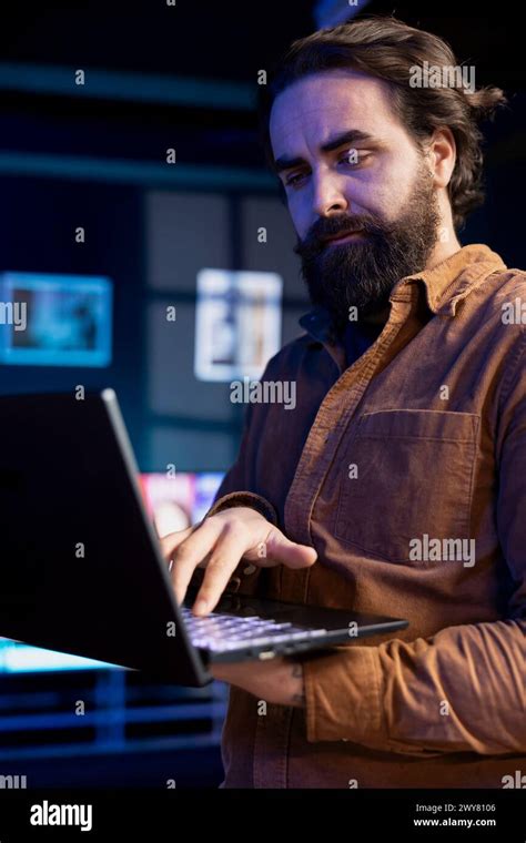 Computer Technician Doing Software Quality Assurance Reading Source Code On Laptop Before